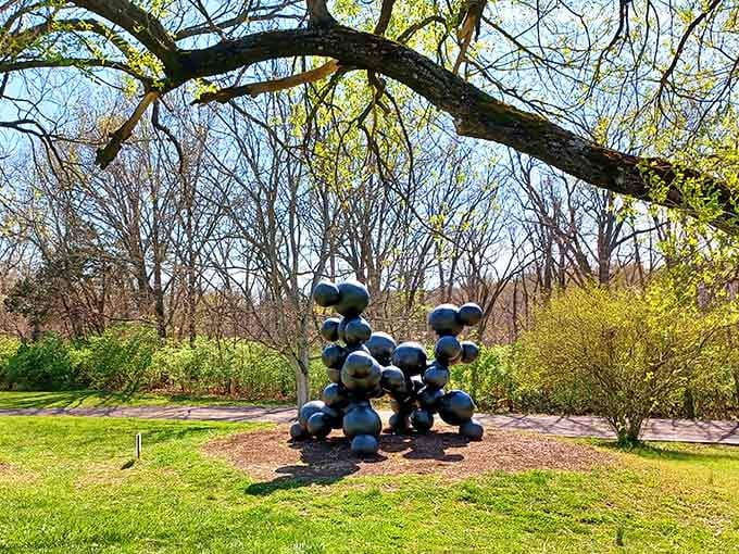 Shiny spheres cluster together like oversized marbles, creating a playful sculpture that catches every ray of sunlight.