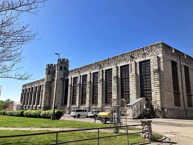 The fortress-like exterior stands proud against blue skies, though its stories are anything but sunny inside.