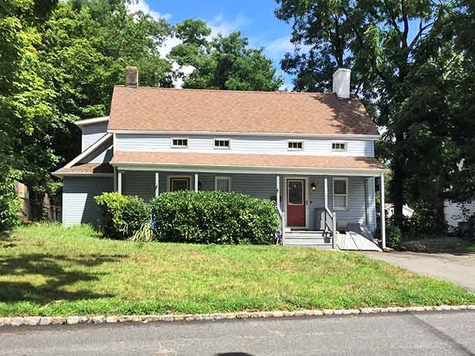This charming home with its welcoming porch represents the quiet residential character that makes Mountainside so appealing.