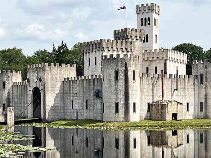 The Texas flag flies proudly above battlements that look straight from King Arthur's court, complete with towers and drawbridge.