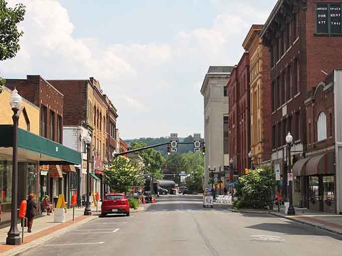 Summer sunshine bathes this welcoming main street where every storefront invites you to slow down and explore.