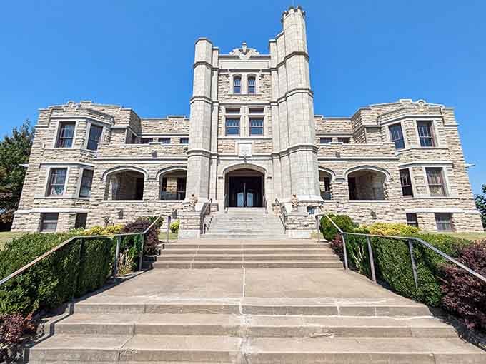 The towers and arched windows create a fairy-tale silhouette against that brilliant blue Missouri sky.