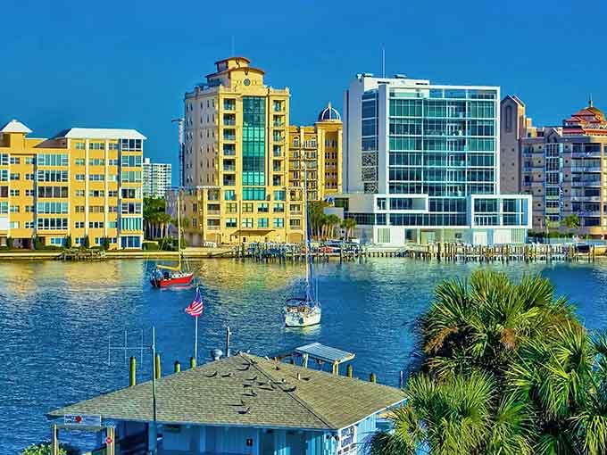 Waterfront living meets architectural elegance in this sun-drenched slice of Gulf Coast paradise where boats bob peacefully below.