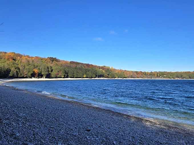Clear shallow waters and endless smooth stones create a shoreline that's equal parts geology lesson and paradise.