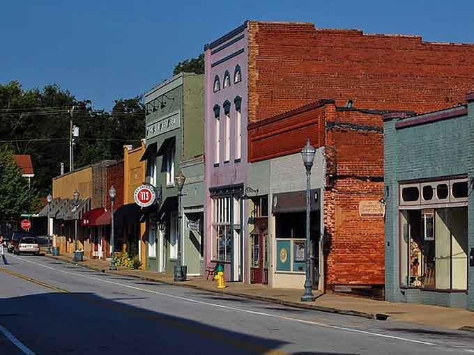 Those pastel facades and vintage lamp posts create a downtown that feels like a warm hug.