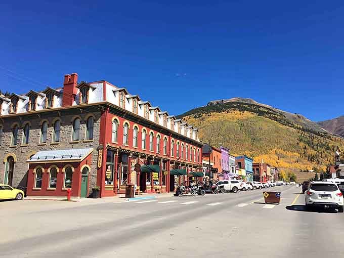 When autumn gold meets mountain air, these historic brick buildings look like they're posing for postcards.