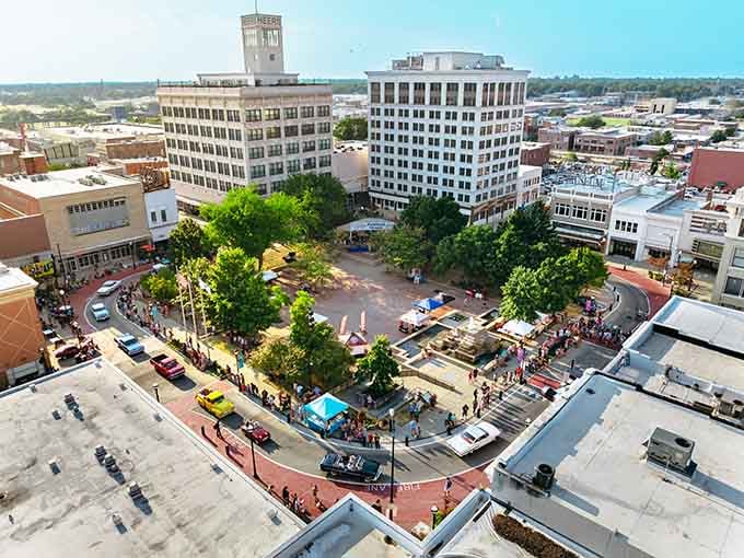 From above, this vibrant downtown plaza buzzes with community life beneath those gorgeous shade trees.