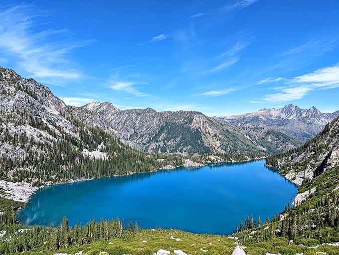Alpine lakes cradled by mountains remind you that nature's the real artist here, no filter needed whatsoever.