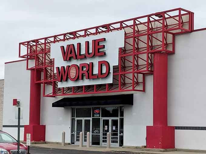 Those bold red steel frames announce serious thrifting ahead, like a Broadway marquee for secondhand shoppers everywhere.