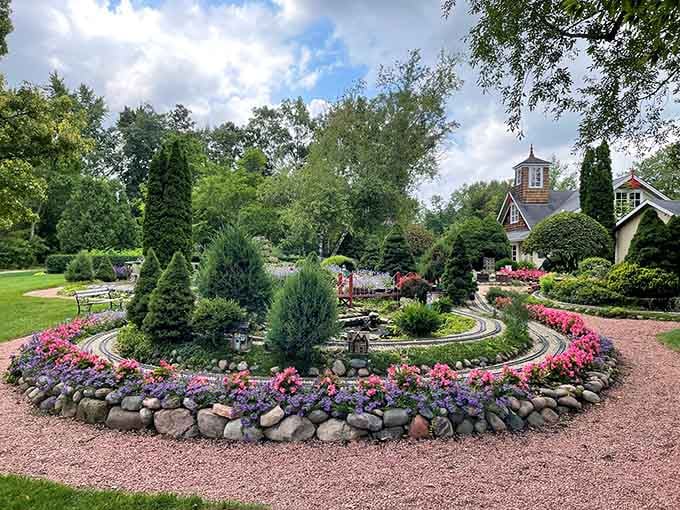 Those miniature train tracks winding through vibrant flowers prove that sometimes the best things really do come in small packages.