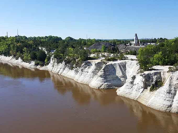 These ancient limestone formations rise like nature's own sculpture garden along the peaceful river below.