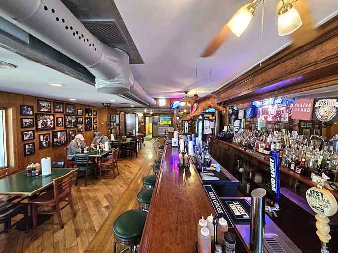 Wood floors, trophy-lined walls, and that welcoming bar create the perfect barbecue sanctuary atmosphere.