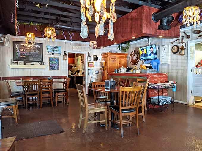 Chandeliers and vintage charm create an atmosphere that's equal parts grandmother's attic and Southern comfort food paradise.