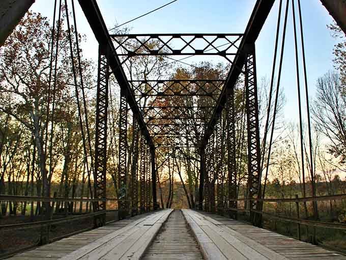 Golden hour transforms rust into bronze, making this abandoned crossing look almost romantic from the right angle.