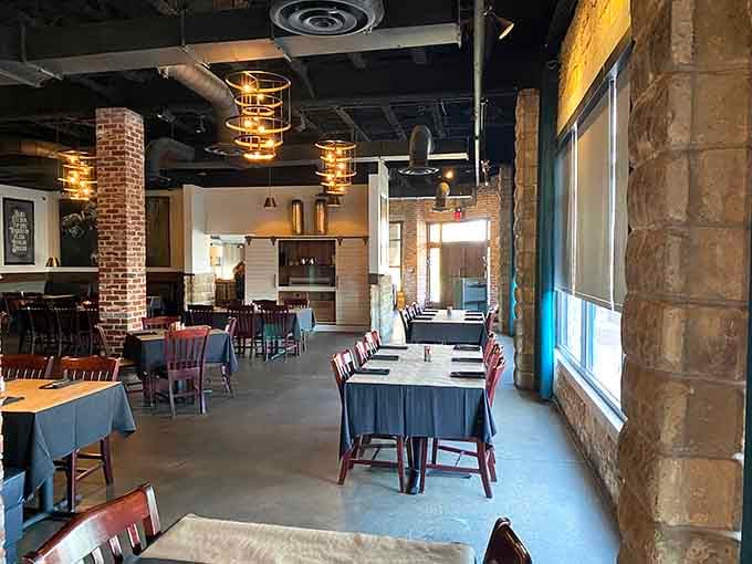 Modern industrial meets Southern comfort in a dining room that somehow feels both sophisticated and welcoming.