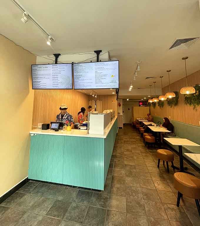 Clean lines, tropical touches, and woven pendant lights create an island vibe without the cheesy tiki bar overload.