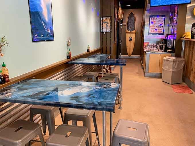 Those surfboard tables aren't just decoration, they're your dining companions for an island feast without the airfare.