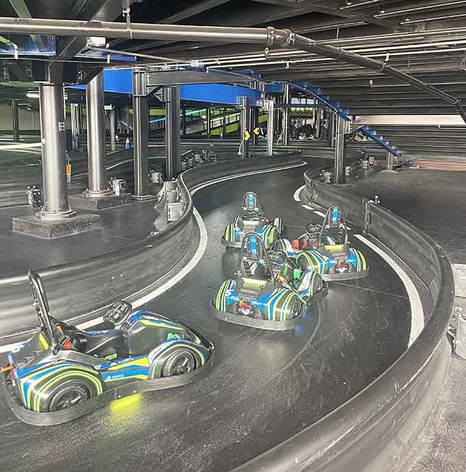 Those electric karts lined up like eager racehorses ready to transform cautious drivers into track legends instantly.