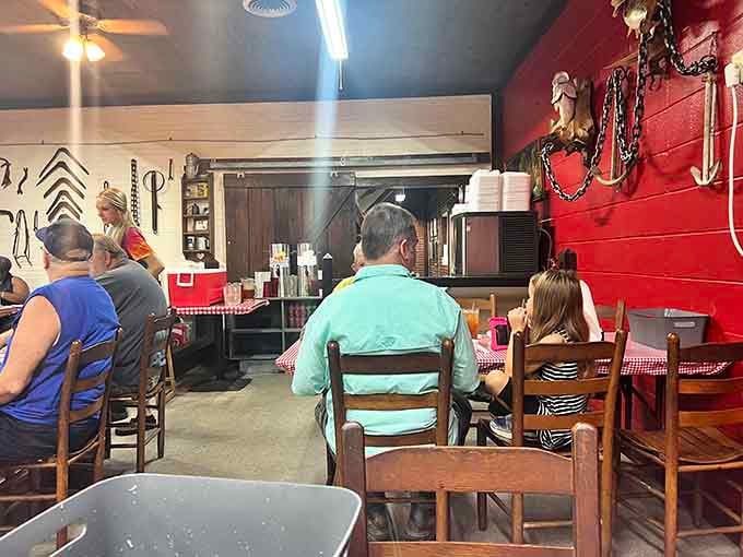 Red walls, checkered tablecloths, and rustic charm create the kind of atmosphere where comfort trumps pretension every time.