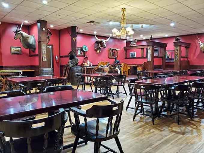 Western decor done right, where mounted game and chandeliers create an atmosphere that says "serious steakhouse."