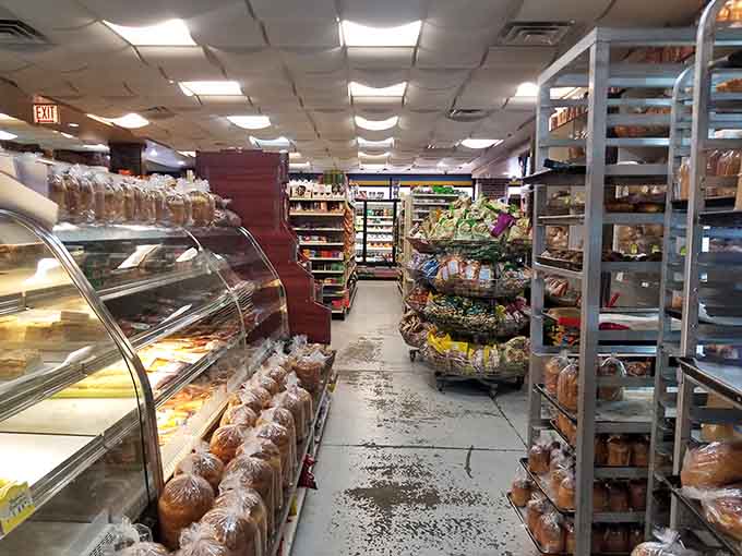 Those display cases stretch on like a bread lover's fever dream, packed with pastries and possibilities galore.