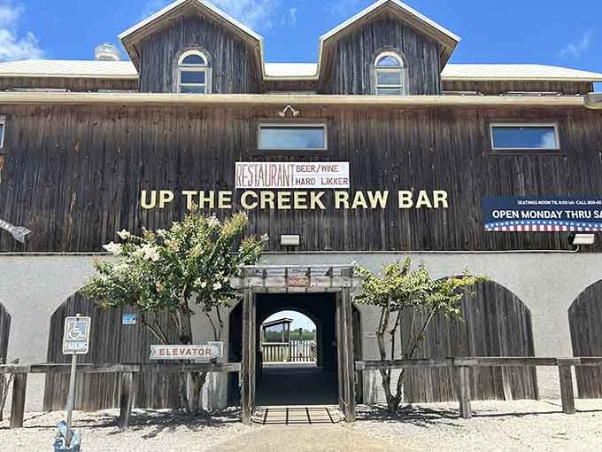 Up The Creek Raw Bar's weathered exterior promises the kind of authentic seafood experience you can't fake with fancy decor.