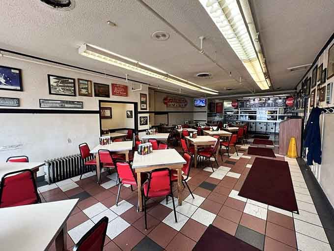 Red chairs, checkered floors, and fluorescent lights: proof that atmosphere takes a backseat when the food's this good.
