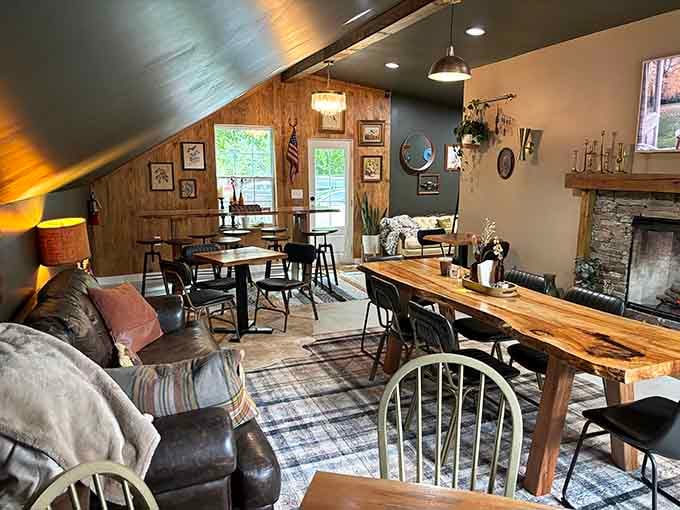 Mismatched furniture, wood paneling, and a fireplace create the living room you wish you actually had at home.