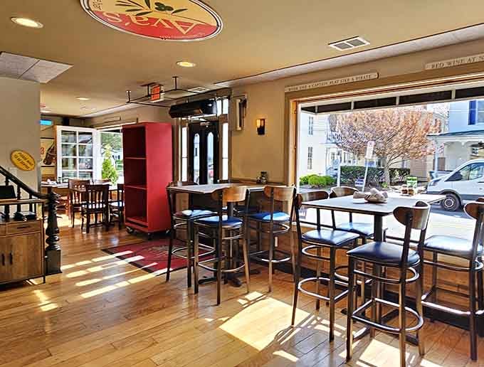 Inside, hardwood floors and cozy seating create the perfect spot to settle in for serious pizza business.