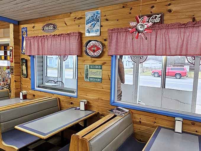 Vintage Coca-Cola signs and gingham curtains create the kind of cozy atmosphere your grandmother would approve of.