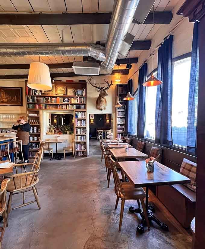 Floor-to-ceiling bookshelves, mounted elk, and industrial chic vibes create the fantasy tavern you've been dreaming about since childhood.