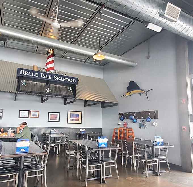 Nautical decor meets modern comfort where exposed ductwork and maritime touches create the perfect casual dining atmosphere for seafood lovers.