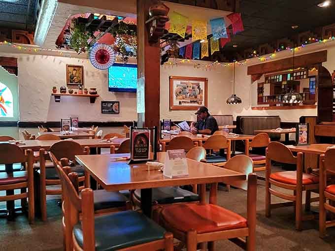 Festive papel picado and warm lighting create the perfect atmosphere for devouring legendary wet burritos.