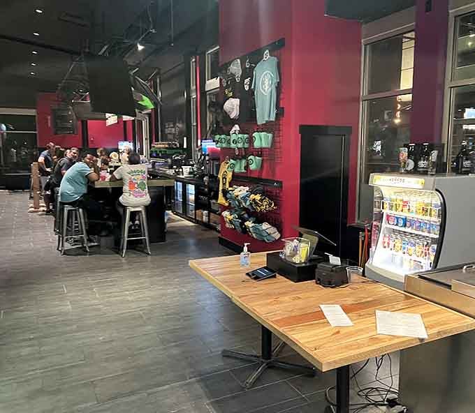 Inside, communal tables and casual vibes create the perfect setting where strangers become friends over smoky ribs and shared napkins.