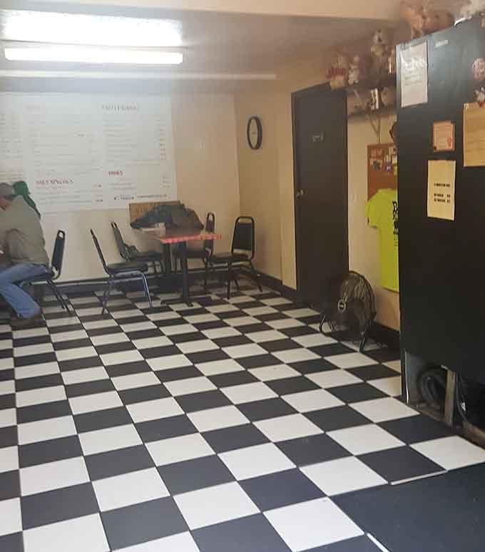 Black and white checkered floors mean business&mdash;this is where serious barbecue happens, not interior design competitions.