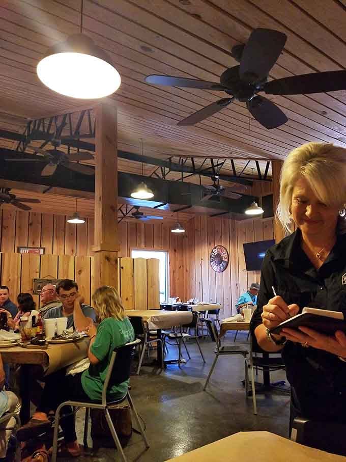Wood paneling and ceiling fans create the kind of comfortable atmosphere where nobody's judging your steak knife technique.