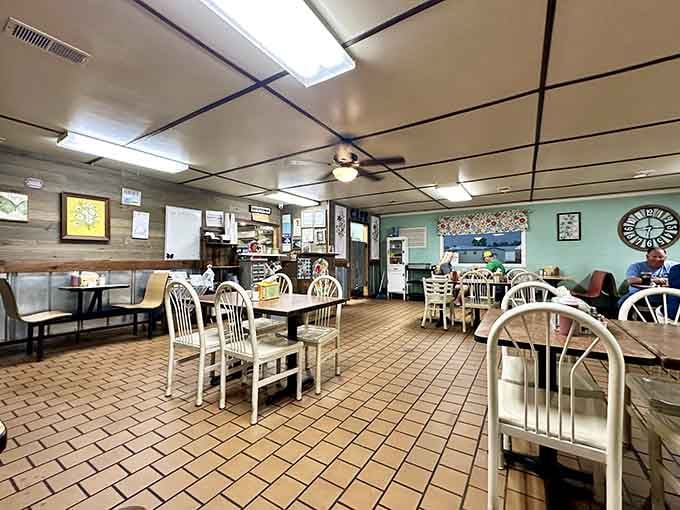 Classic cafe vibes with turquoise walls and tile floors mean business, not fancy Instagram backdrops.