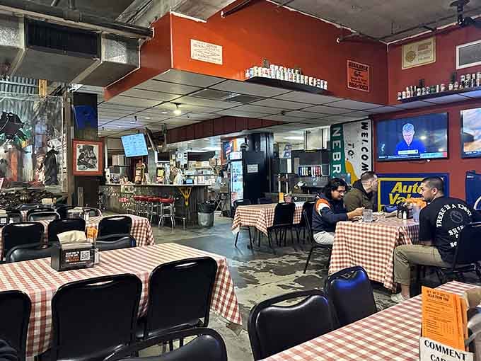 Red checkered tablecloths meet industrial chic in a space that proves barbecue joints don't need fancy to be fantastic.
