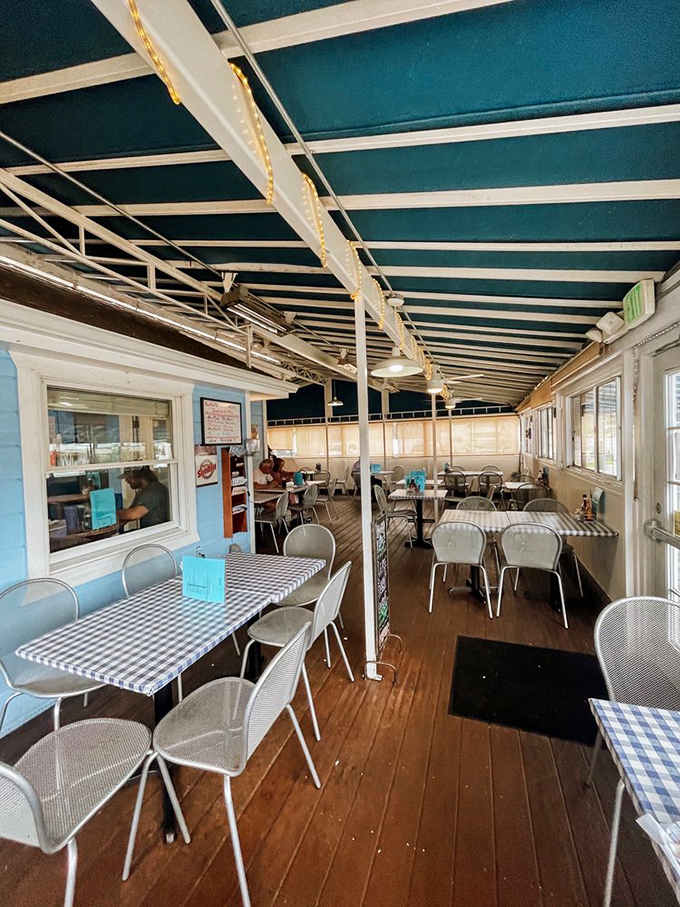 Checkered tablecloths and a covered patio where burgers meet their destiny, one happy customer at a time.