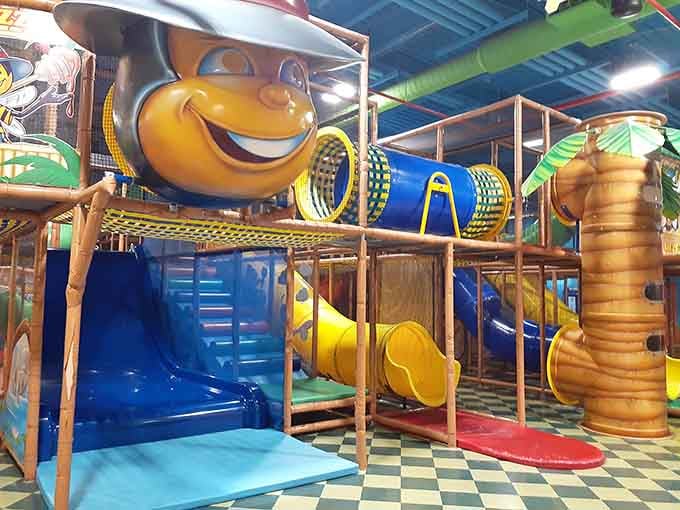 That grinning bee knows exactly what he's doing, luring kids into the most elaborate obstacle course this side of Manhattan.