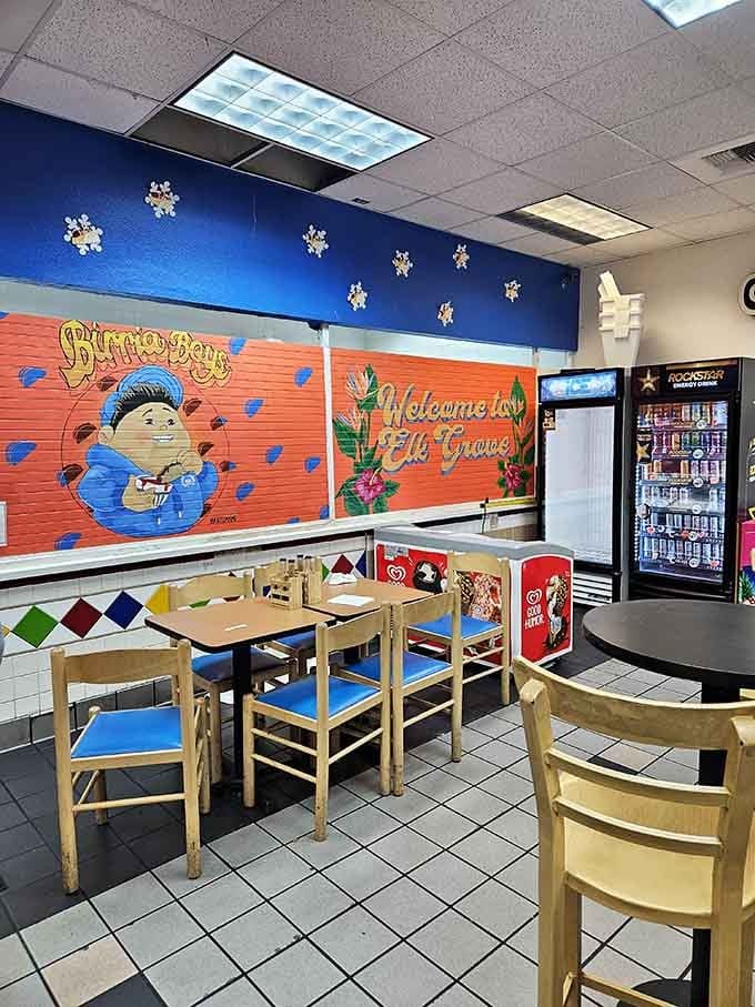 That vibrant mural and those cheerful blue chairs prove this isn't your average convenience store dining experience.