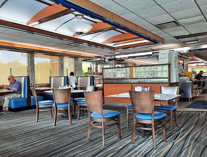 Classic diner booths and counter seating where countless conversations have unfolded over perfectly poured coffee and exceptional omelets.