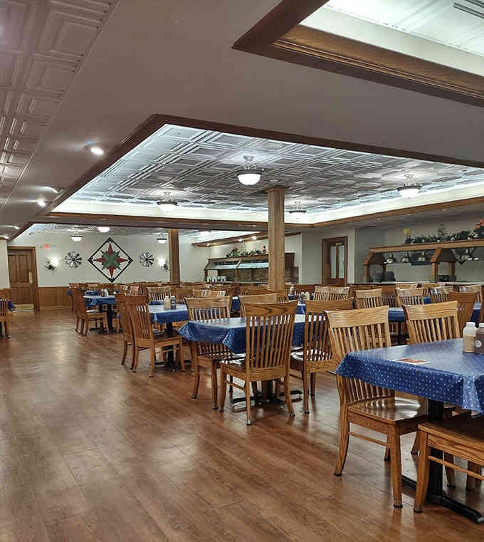 Clean lines, warm wood, and blue tablecloths create a dining room that feels like Sunday dinner at Grandma's.
