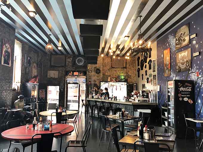 Inside, the zebra-striped ceiling and eclectic art collection prove that normal is overrated when you're serving exceptional food.