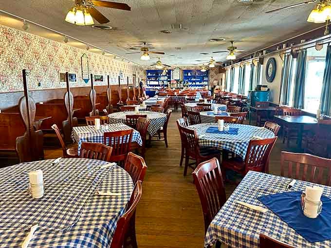 Checkered tablecloths and ceiling fans create that timeless diner atmosphere where everyone feels like a regular from day one.