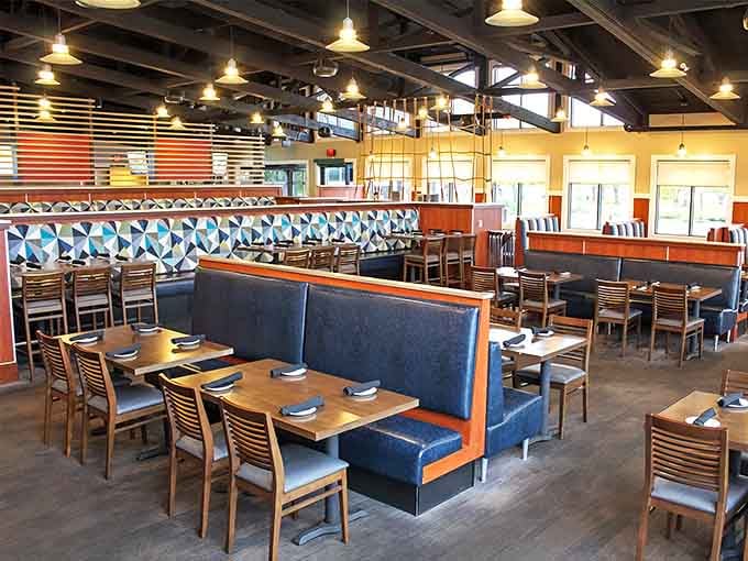 Modern comfort meets maritime charm in a dining room where every seat feels like the captain's table.