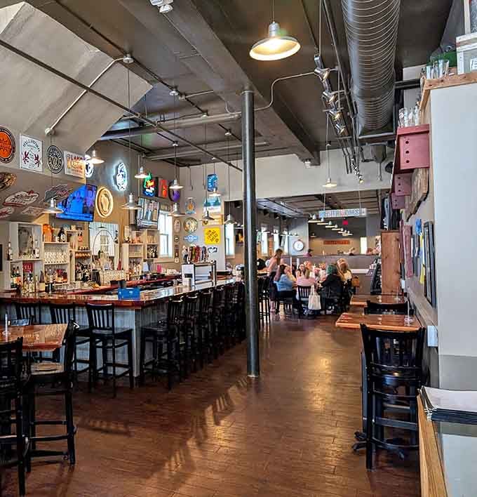 Industrial chic meets Midwest comfort in a space where exposed ducts and warm wood create barbecue paradise.