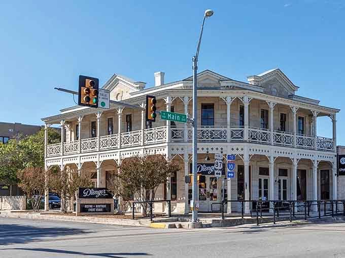 That ornate balcony architecture isn't just for show; it's Texas Hill Country elegance meeting practical shade in perfect harmony.
