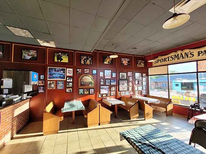 Sports memorabilia and checkered tablecloths create the perfect setting for serious pizza consumption and friendly debate.