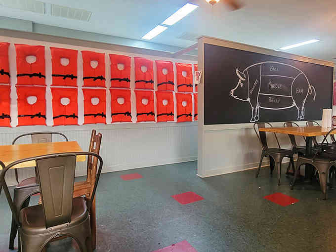 Inside, whimsical touches like life jacket wall art and chalkboard pig diagrams prove great food doesn't require stuffiness.